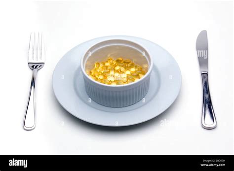 Vitamin E Caplets In A White Ramekin Dish Set For A Supplement Lunch