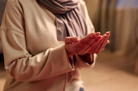 Premium Photo Focus On Open Palms Of Young Muslim Woman In Beige