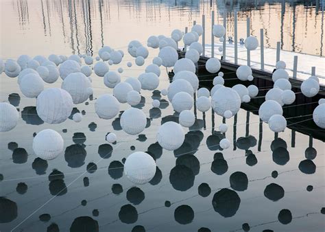Sensual Wave Installation Illuminates An Empty Dock At French Harbour