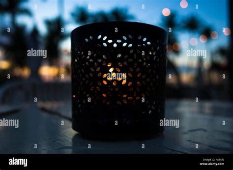 Romantic Candlelit Table With View Of Beach Sunset And Coconut Trees At Sentosa Island