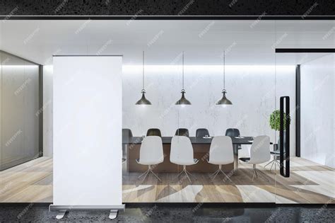빈 흰색 모의 포스터 스탠드 테이블 컴퓨터 모니터 안락의자와 유리 벽 파티션 3d 렌더링 뒤에 장식용 식물이 있는 현대적인 콘크리트 및 목재 회의실 내부 프리미엄 사진