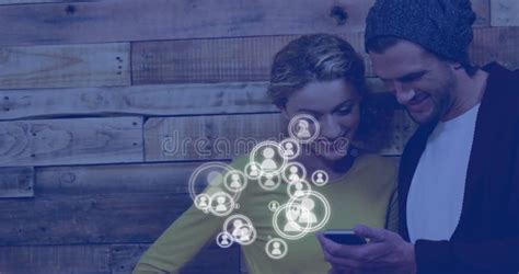 Animation Of Social Media Icons Over Caucasian Couple Using Smartphone Stock Footage Video Of