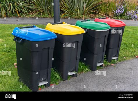 Colour Coded Black Recycle Bins For Rubbish Waste And Litter Of Plastic