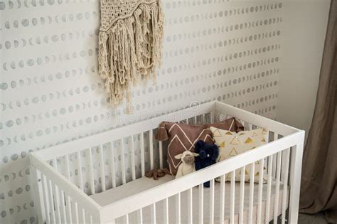 A White Crib With A Blue And White Striped Blanket Stock Image Image Of Furniture Newborn