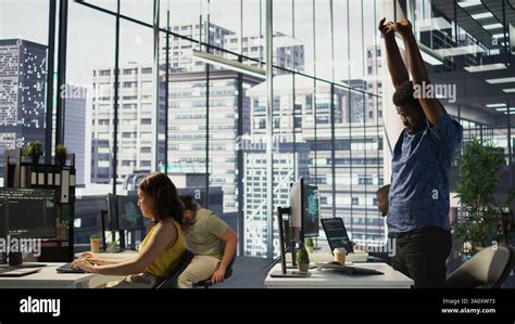 Tired Admin Stretches Limbs While Using Pc For Artificial Intelligence