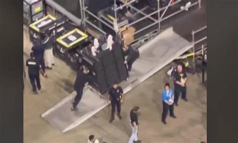 Heres Taylor Swift Secretly Arriving On Stage In A Cleaning Trolley