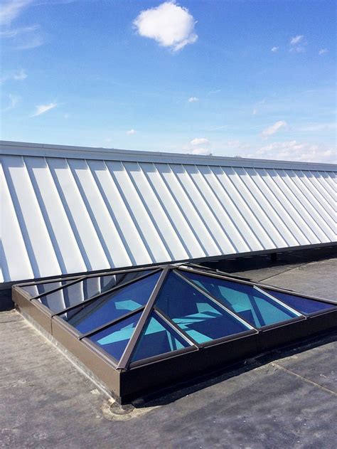 The Roof Is Made Of Metal And Has A Skylight On Its Side