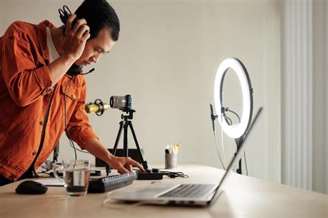 Premium Photo Asian Man Adjusting Sound Settings