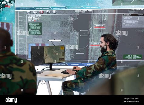 Military Recruit Collecting Real Time Data From Satellite Radar System Working On