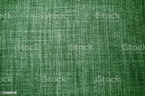 녹색 배경 직물 질감 모직 천의 조각이 표면에 깔끔하게 배치되어 있습니다 직조 및 섬유 질감 드레스 직물 또는 부엌 필요 식탁보 또는 커튼 클로즈업 대시 Webbing