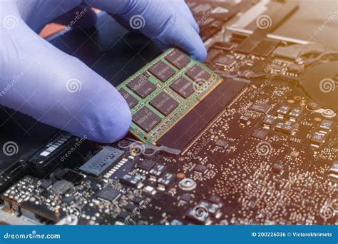 Service Engineer Install New Ram Memory Chips To The Laptop Repairing