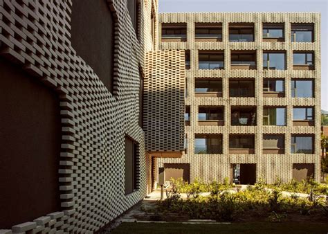 Brick Pixel Patchwork Envelops Housing By Buzzi Studio Di Architettura