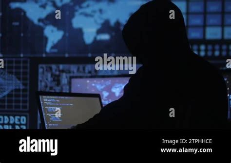 Anonymous Man Geek Hacker In Hood Working At Computer In Cyber Security