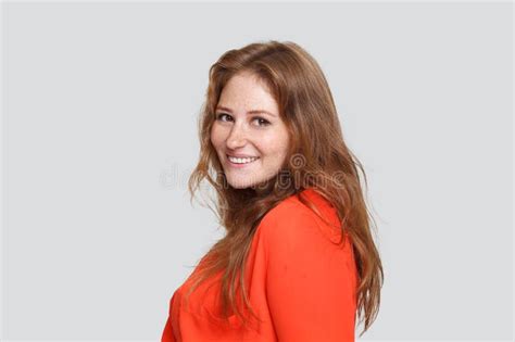 Perfect Redhead Woman Smiling And Looking At Camera On White Background