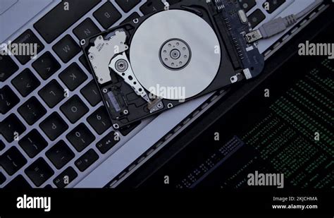 Hard Drive Lies On The Laptop Keyboard Flashes And Disk Spins Stock Video Footage Alamy