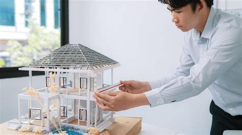 Premium Photo Professional Male Asian Engineer Measure House Model By Using Ruler Immaculate