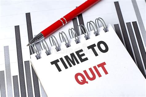 TIME TO QUIT Text Written On Notebook With Pen On Chart Stock Image