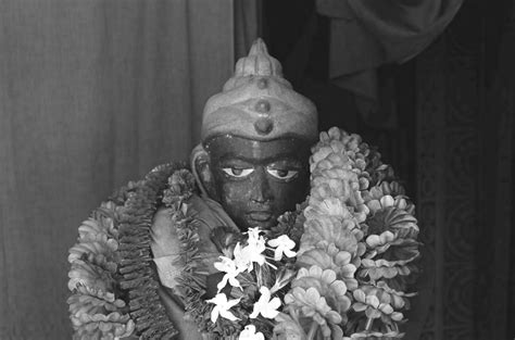 Statue Of Vishnu Deviyo Covered In Garlands And Flowers At Small