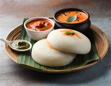 Premium Photo Idly Sambar Or Idli With Sambhar And Green Red Chutney Popular South Indian