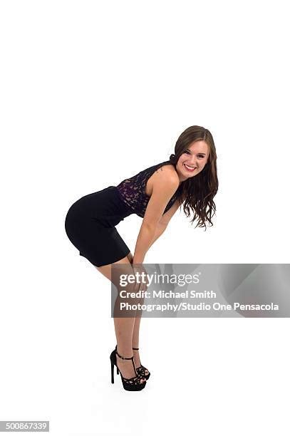 Young Brunette Female In Black Dress Bending Over Photo Getty Images
