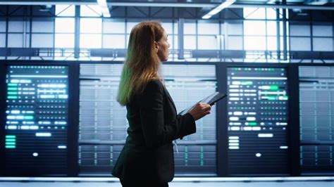 Engineer In Server Hub Checking Recovery Plan On Tablet Monitoring Rackmounts Energy