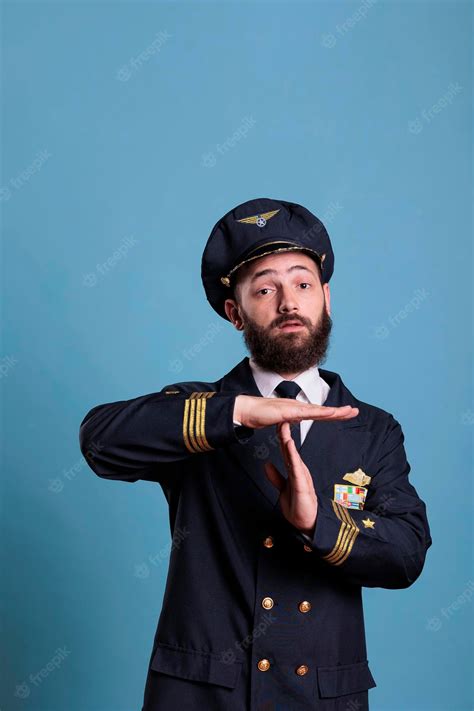Premium Photo Airplane Pilot Showing Time Out Gesture With Hands