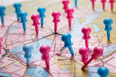 Premium Ai Image Pink And Blue Pushpins Showing Marking Location On Map