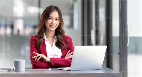 Portrait Of Smiling Beautiful Business Asian Woman In Pink Suit Working