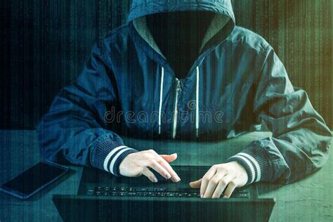 Anonymous Hacker Uses A Laptop To Hack The System Stealing Personal Data And Infection Of