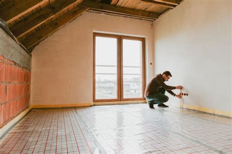 Premium Photo Construction Site Worker Checking The Measurements