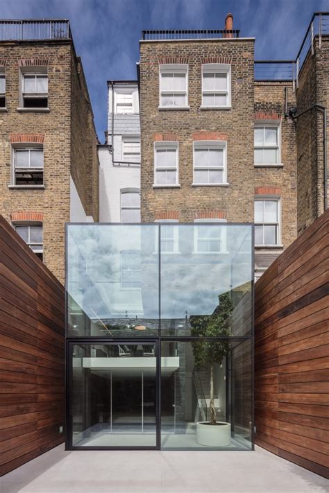 Glass Box Defines Extension With Basement Pool To Victorian Home In South London