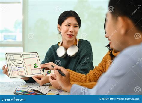 Team Of Creative People Brainstorming And Discussing For Mobile Application Software Design