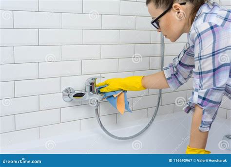 House Cleaning Woman Is Cleaning In The Bathroom At Home Stock Image