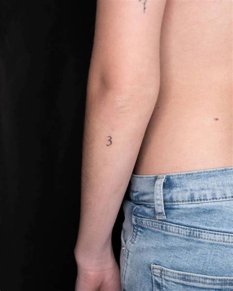 Minimalist Number 3 Tattooed On The Forearm