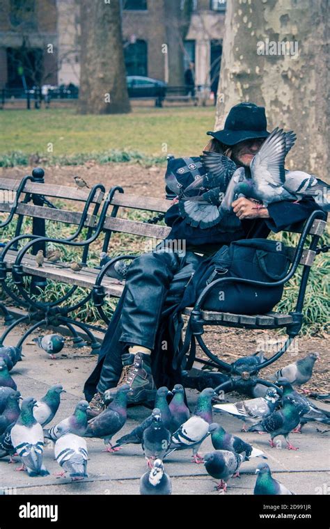 Larry Reddick Known As Larry The Birdman Feeding A Flock Of Pigeons