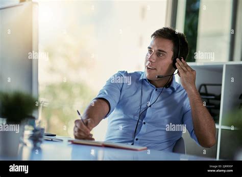 Resolving Issues Quickly For His Clients A Call Centre Agent Working