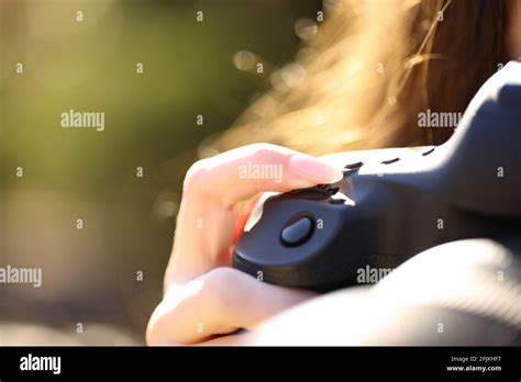 Close Up Of A Photographer Finger Adjusting Shutter Speed With Dial On Mirrorless Camera Stock