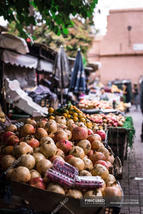Stalls With Fresh Ripe Fruits Located On Street Marketplace In