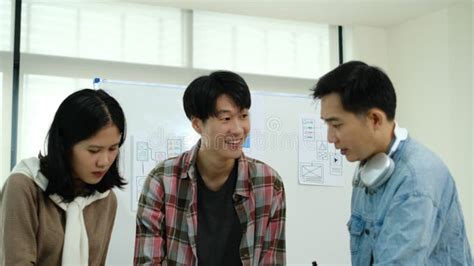 Tilt Down Shot Of Developer Team Collaborating And Planning Template Layout For Mobile