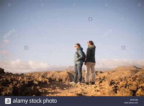 Senior Mother And 45 Year Old Son Spend Time Together Walking On An