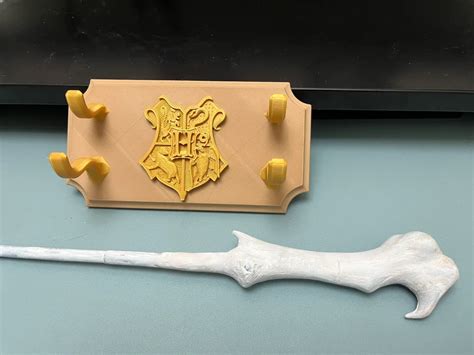Wand Wall Mount With Hogwarts Seal Free 3d Print Model Makerworld