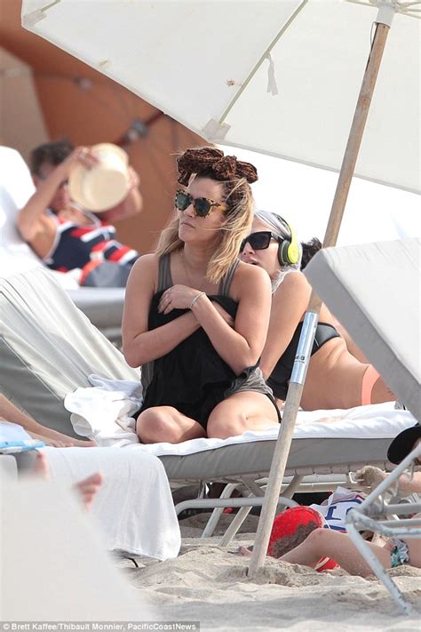 Caroline Flack Goes Braless While Sunbathing On A Beach In Miami With