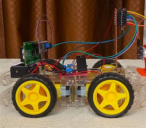 Iot Based Electric Bus With Ultrasonic Sensor And Web Controlled