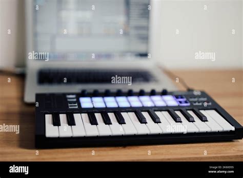 Midi Keyboard Musician Playing Midi Keyboard For Arranging Music On Laptop Computer Music