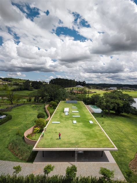 Monumental Grassy Roof Covers Planar House In Brazil By Studio MK27