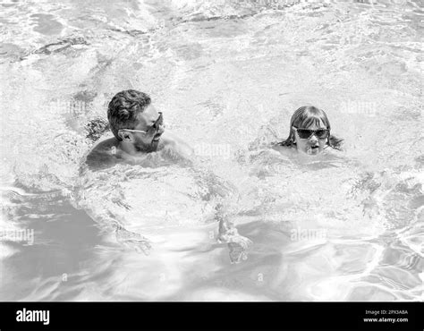 Father And Son Wear Glasses In Swimming Pool Water Daddy With Kid Boy On Spa Resort Stock Photo