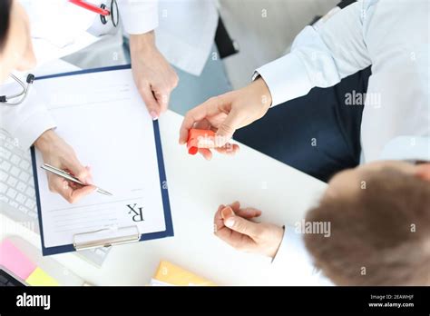 Doctor Writing Patient Prescription For Hormonal Inhaler Closeup Stock Photo Alamy