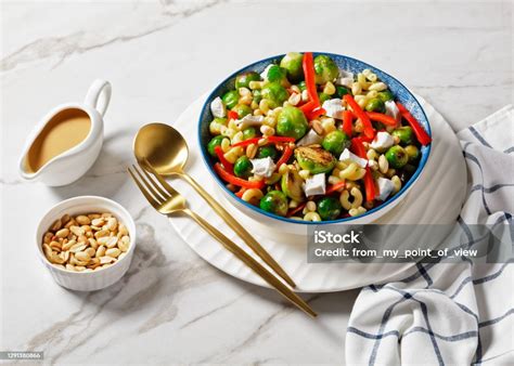Macaroni Salad With Broccoli Sprouts Bell Pepper Strips Feta And Peanut