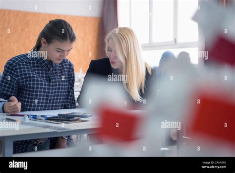 Female Architecture Teacher At Work Female Professor Explain Architectural Projects To Babes