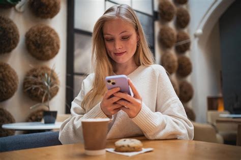 Premium Photo Influencer Girl Taking A Photo Of Her Coffee To Share